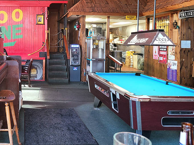 A pool table offers entertainment for those waiting for tables or looking to extend their visit with a friendly game.