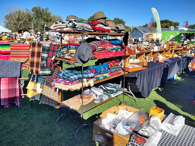 Cozy blankets and textiles in vibrant patterns, stacked high and ready to warm new homes.