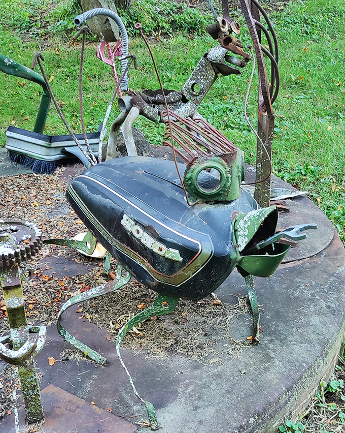 Gleaming metal fish swim through air instead of water, their scales fashioned from flattened cans and industrial scraps.