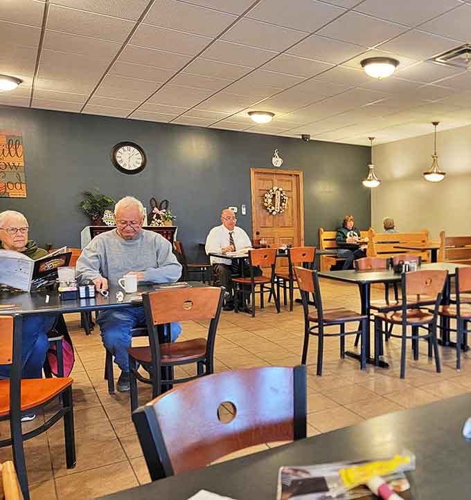 The spacious seating area welcomes morning coffee clubs, business meetings, and families with equal warmth and comfortable simplicity.