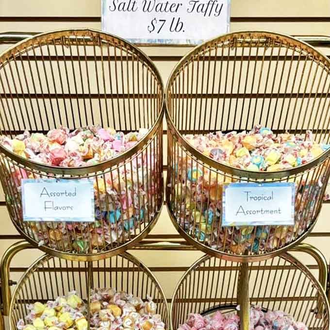 The salt water taffy display offers a rainbow of nostalgia, each twisted piece promising a chewy trip back to simpler times and seaside memories.