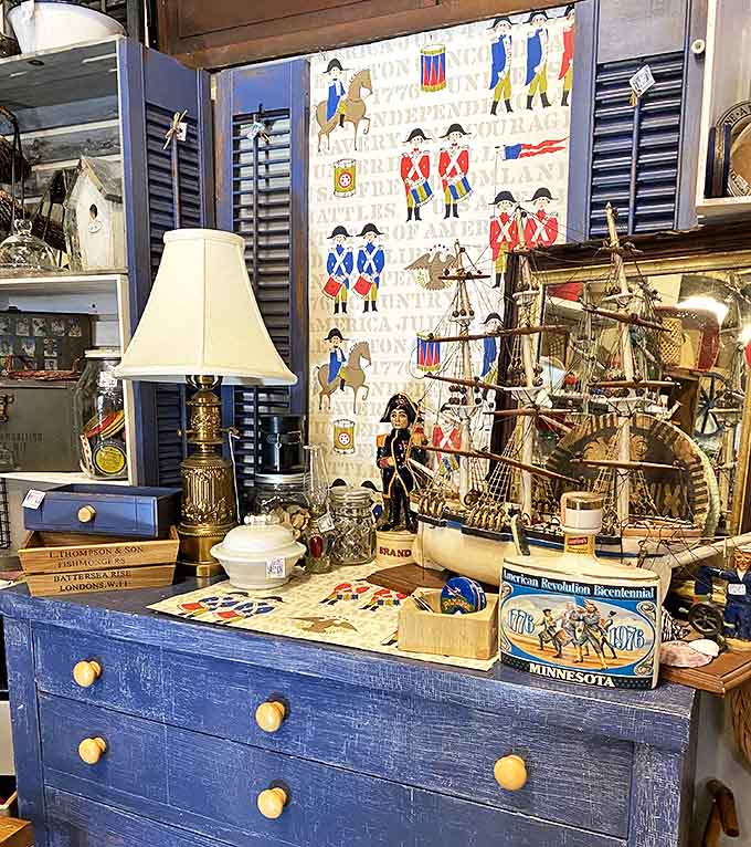A patriotic display celebrates American history through carefully curated vintage items, model ships, and memorabilia spanning multiple decades of national pride.