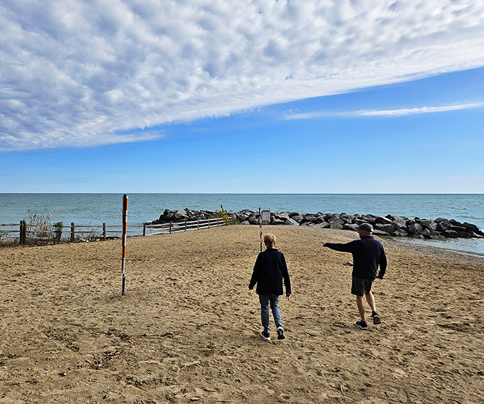 Beach explorers discover the joy of simple pleasures along the shoreline, where every step offers new treasures and perspectives on this Great Lakes gem.