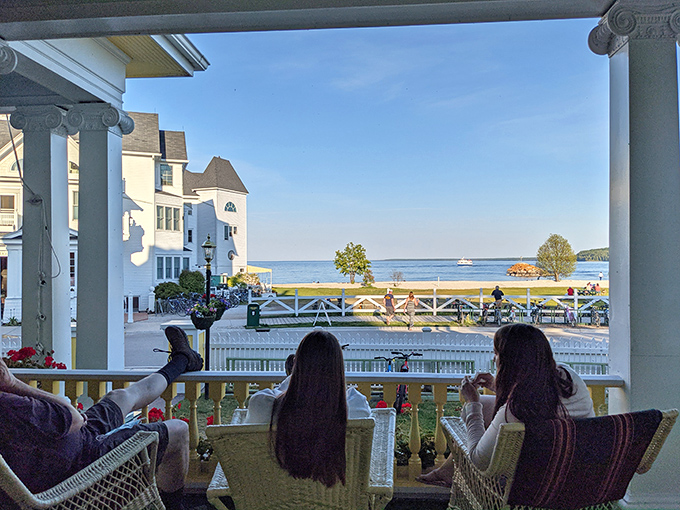 The porch becomes an evening gathering spot where guests toast the sunset while Lake Huron provides the perfect backdrop.