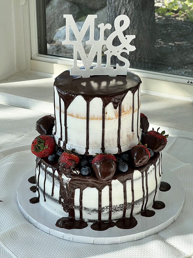 This two-tier wedding cake with chocolate-covered strawberries and dramatic drizzle proves that Potters can do elegant just as well as they do everyday delicious.