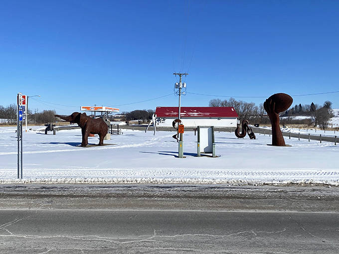 Even in winter's embrace, these metal sculptures stand defiant against Minnesota's snow, creating dramatic silhouettes against the white landscape.