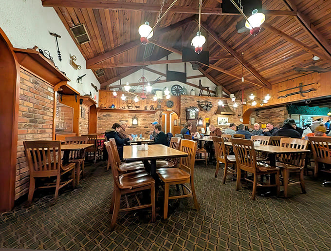 The dining room hums with conversation as patrons enjoy unhurried meals in a space where human connection takes precedence over digital distraction.