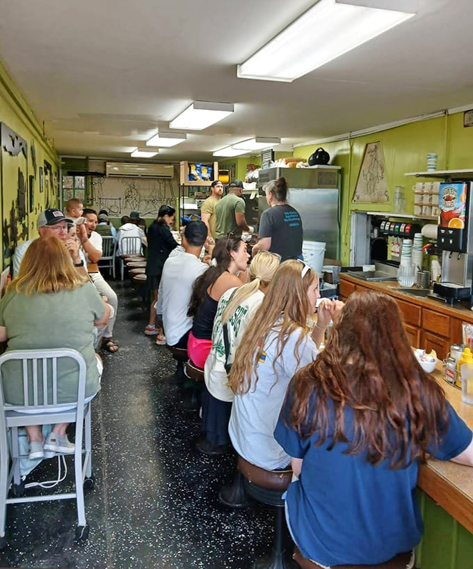 Where strangers become friends over shared food recommendations. The narrow space creates the perfect excuse for starting conversations.