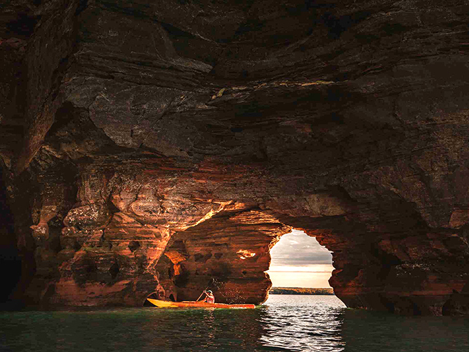 The sea caves transform into nature's cathedral when viewed from water level, where every paddle stroke reveals another wonder carved by time.