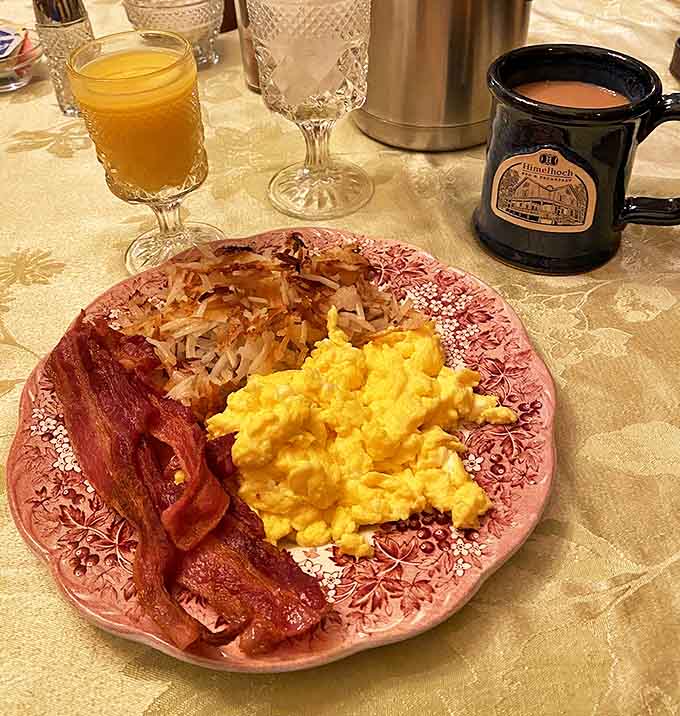 Bacon and Eggs: Breakfast perfection on pretty pink plates&mdash;scrambled eggs fluffy as clouds, bacon crisp-yet-tender, and coffee that makes mornings worthwhile.