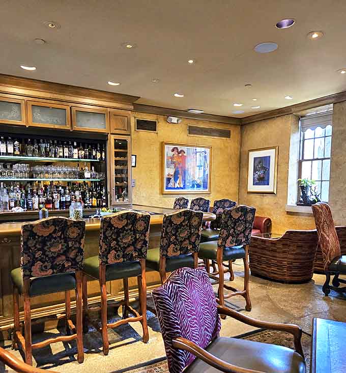 Rich wood and patterned upholstery create a sophisticated watering hole where literary giants might have discussed manuscripts over perfectly crafted manhattans.