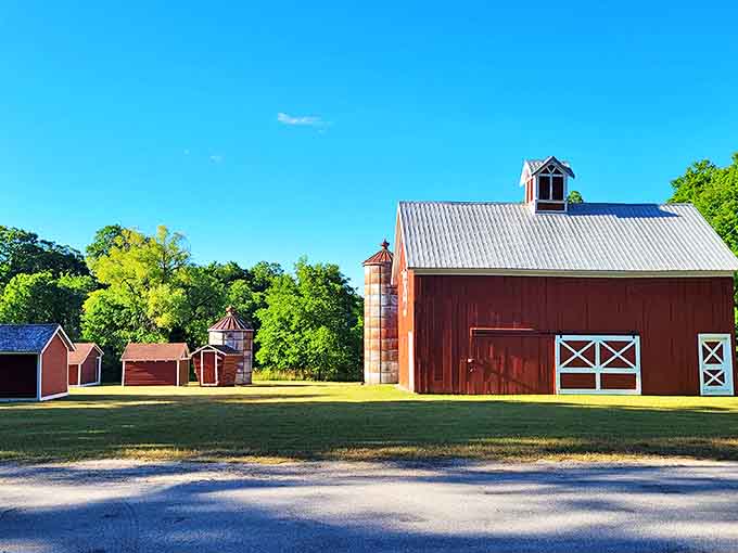 This picturesque red barn stands as a perfect time capsule, its weathered wood telling stories of Michigan's agricultural heritage.