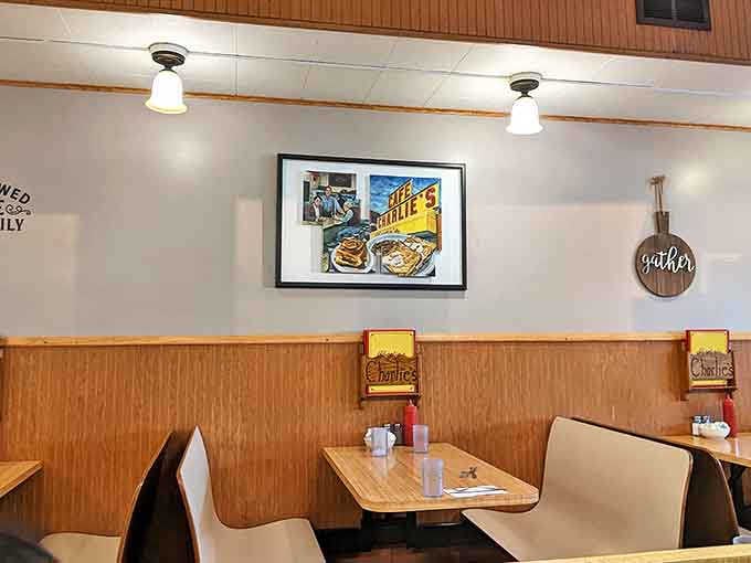 Simple booth seating with wood paneling creates that timeless diner atmosphere that feels like coming home.