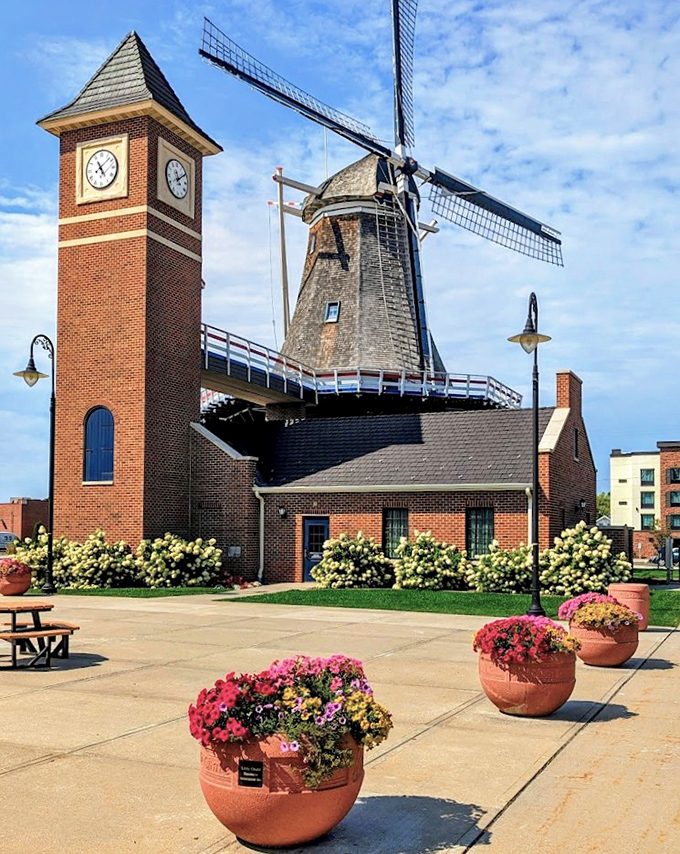 The windmill and clock tower create an iconic silhouette against the sky, becoming a beloved landmark for locals and visitors alike.