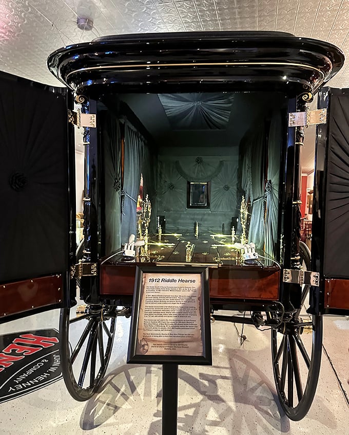 The Cawley & Peoples Mortuary Museum displays a 1912 Riddle Hearse, an elegant reminder that even final journeys were once made with Victorian splendor.