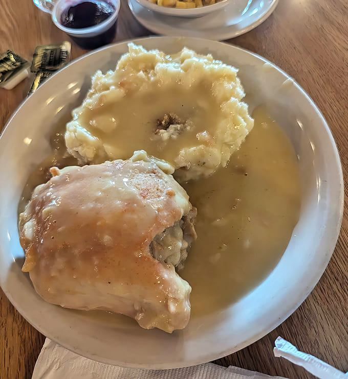 Tender chicken bathed in savory gravy creates a volcano-like crater in mashed potatoes &ndash; a plate that demands to be cleaned.