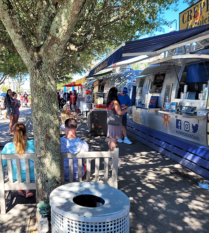 Customers gather at outdoor seating areas, turning meals into social occasions where food stories and vacation tips are freely exchanged.