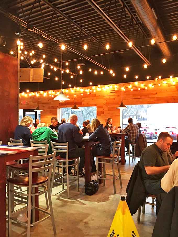 Happy diners lost in conversation and the serious business of enjoying perfectly smoked meats.