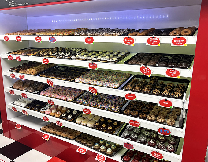 Donut Display: The glass case of temptation where willpower goes to die and "just one" becomes a mathematical impossibility.