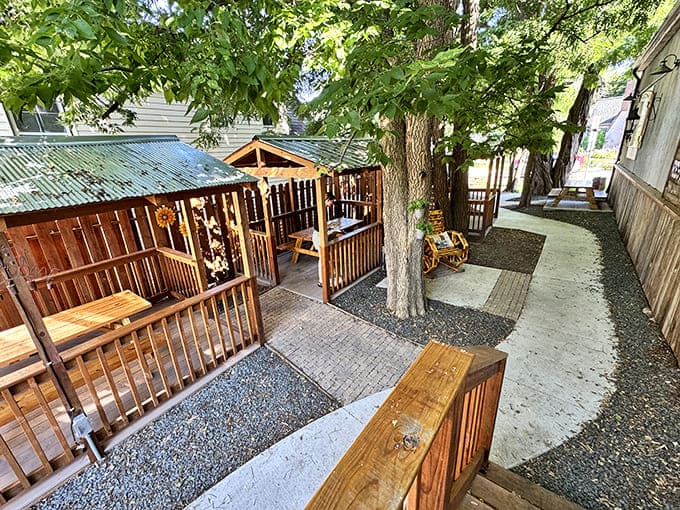 A peaceful garden pathway leads between dining areas, where trees provide natural shade for this little slice of Havana in Minneapolis.