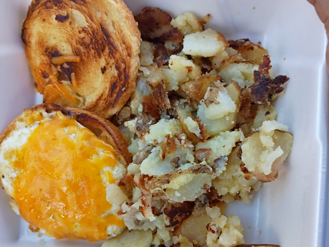 Breakfast alchemy at its finest – crispy potatoes, melted cheese, and perfectly toasted bread forming the holy trinity of morning satisfaction.