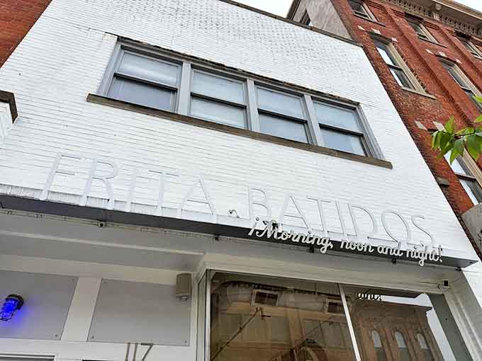 Subtle yet confident, the restaurant's name etched in white brick announces itself without shouting&mdash;the culinary equivalent of a knowing wink.