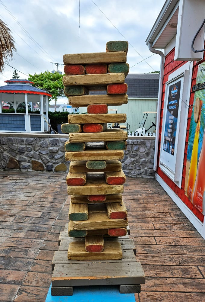 Giant Jenga: where structural engineering skills improve inversely to the number of mojitos consumed. Physics has never been this fun.