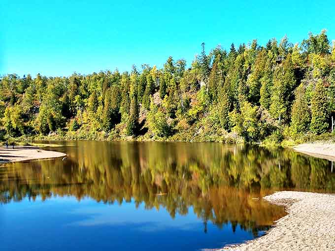 Still waters create perfect reflections of the surrounding forest, doubling the beauty in this serene section of the park.