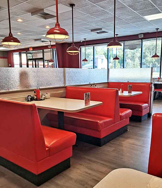Cherry-red booths invite you to slide in and stay awhile, under pendant lights that make everyone look like they're starring in their own movie.