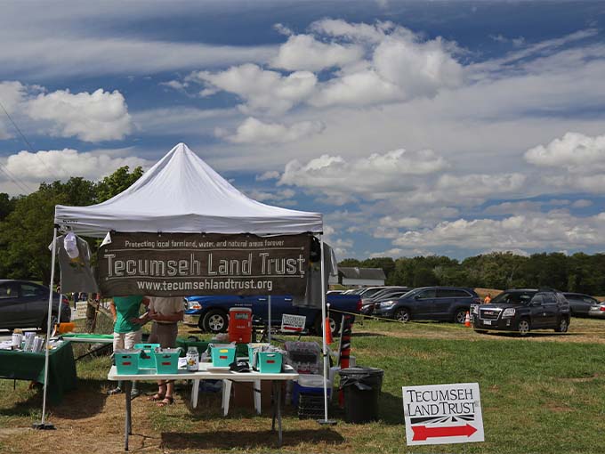 Conservation in action &ndash; the Tecumseh Land Trust booth educates visitors about their mission to preserve natural beauty for generations.