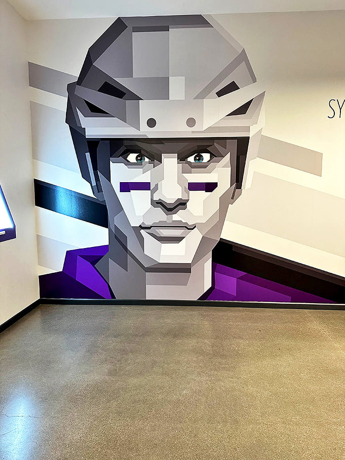 A geometric face mural watches over visitors with pixelated intensity. Even the wall art plays with your perception in this mind-bending space.