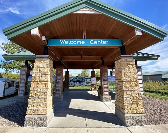 The welcome center greets visitors with rustic charm and practical information &ndash; the gateway to adventures waiting just beyond.