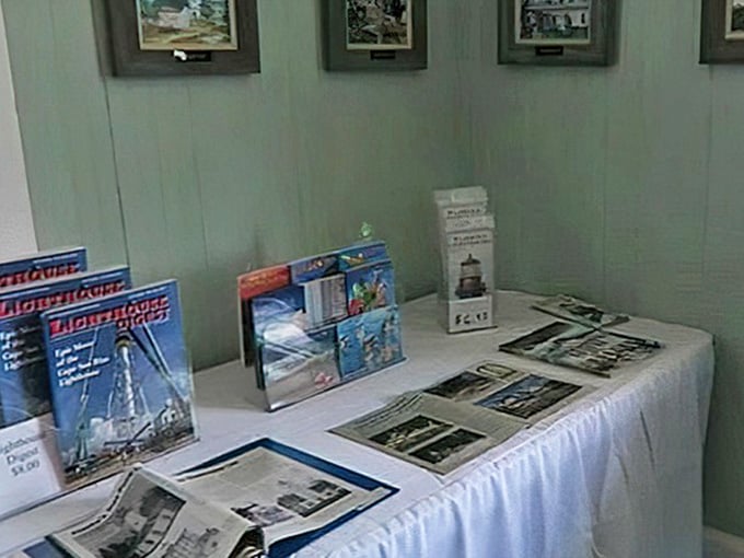 The gift shop display offers lighthouse memorabilia for people who want to remember their visit with something more permanent than phone photos.