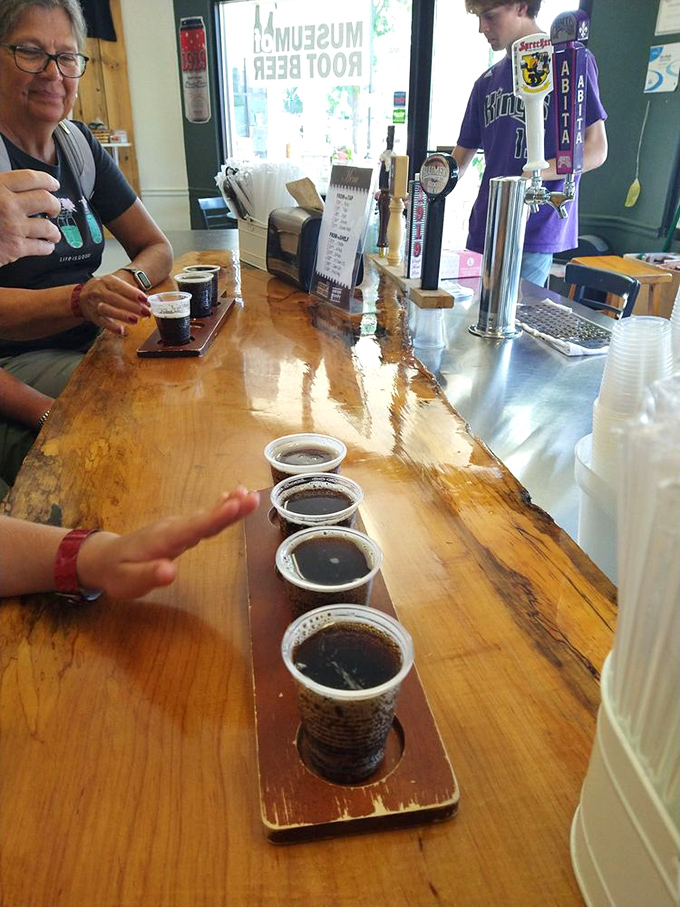 Visitors sample different root beers at the rustic wooden bar &ndash; discovering that this seemingly simple beverage contains surprising complexity.