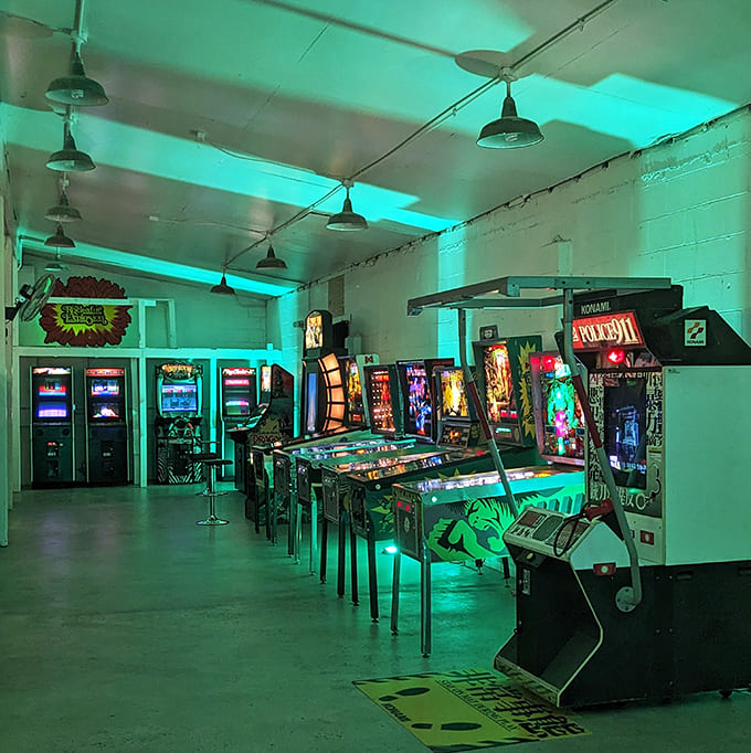 The ethereal glow of arcade cabinets creates an almost dreamlike atmosphere, as if powered by pure nostalgia rather than electricity.
