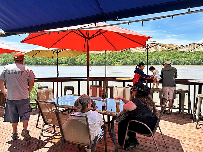 Riverside dining with a view of where your cardboard creation might meet its watery fate. The perfect spot to toast both victory and spectacular failure.