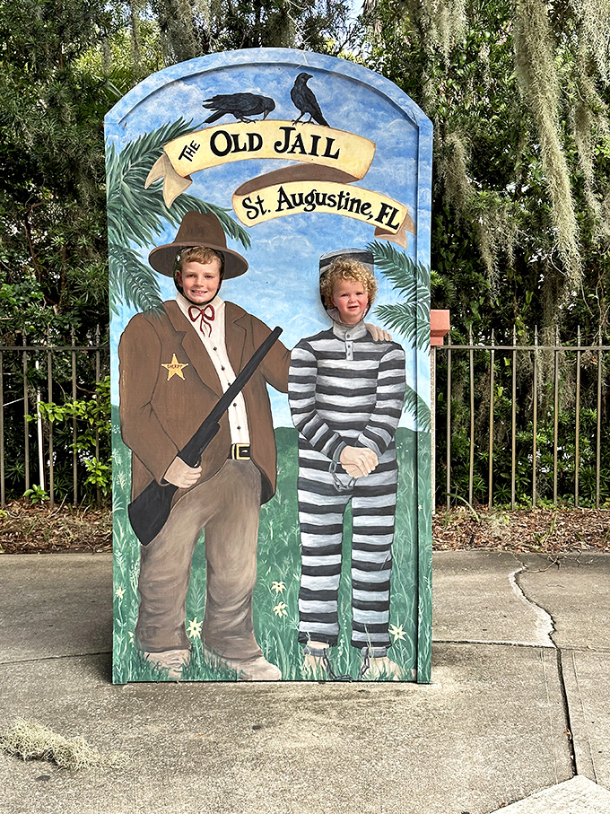 Families create lasting memories at this photo opportunity, where children discover history through playful engagement.