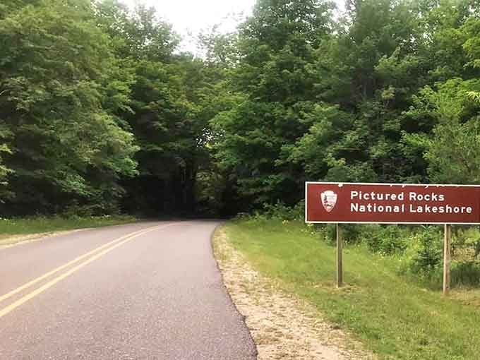 The Pictured Rocks National Lakeshore sign welcomes travelers to a wonderland where forest meets shore in a celebration of Michigan's natural diversity.