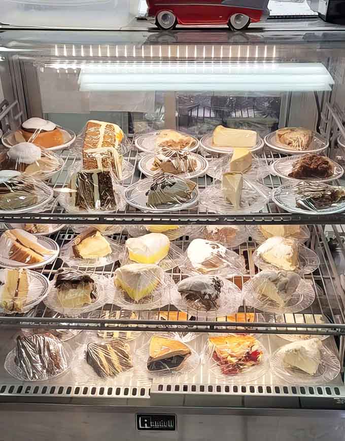 The pie case stands like a museum of dessert perfection, each slice promising to be the ideal conclusion to your meal.