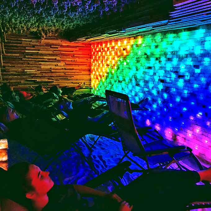Rainbow lights transform the salt room into a therapeutic light show, where relaxation gets a technicolor upgrade.