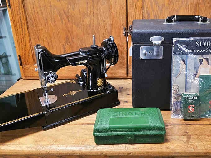 This classic black Singer sewing machine with its elegant curves represents an era when "built to last" wasn't just a marketing slogan.