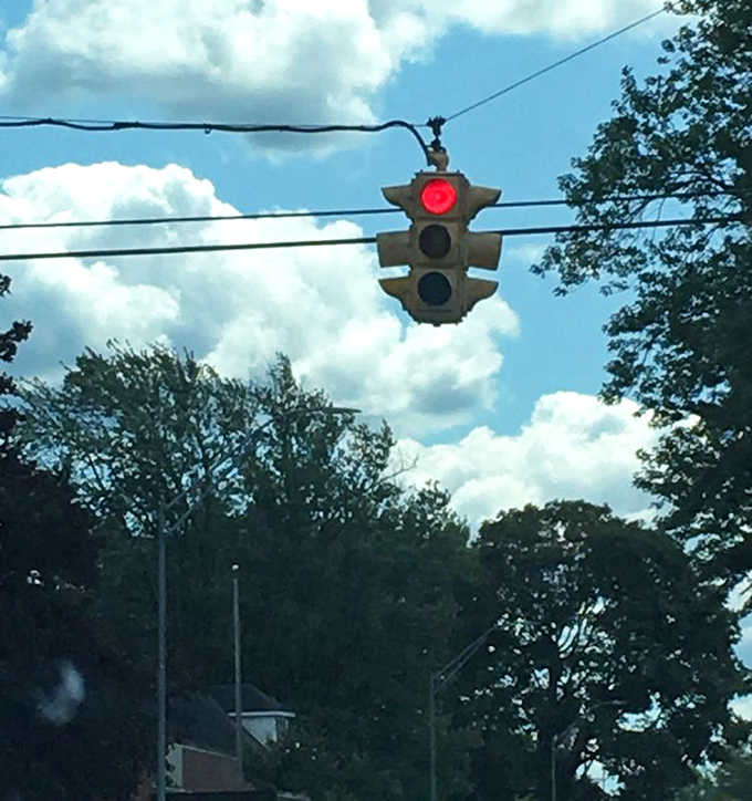 This charming miniature traffic signal adds whimsical character to the bridge approach, a small-town touch visitors find endearingly unique.