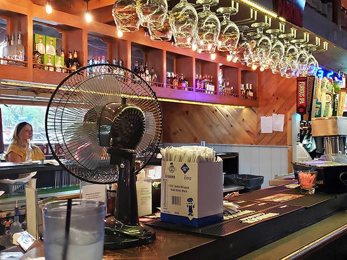Behind every great BBQ joint is a well-stocked bar with glasses hanging like promises of good times to come.