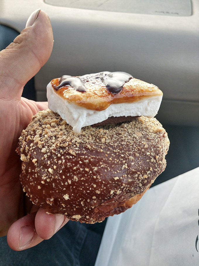 S'mores Donut: Campfire nostalgia meets bakery brilliance in this marshmallow-topped masterpiece &ndash; summer memories in circular form, minus the mosquitoes.