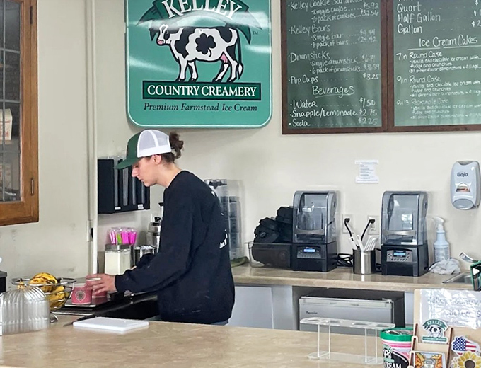 The iconic Kelley Country Creamery logo watches over as another batch of happiness is served.