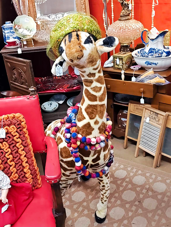This whimsical giraffe stands tall among the treasures, sporting a colorful pom-pom necklace that adds just the right touch of fun.