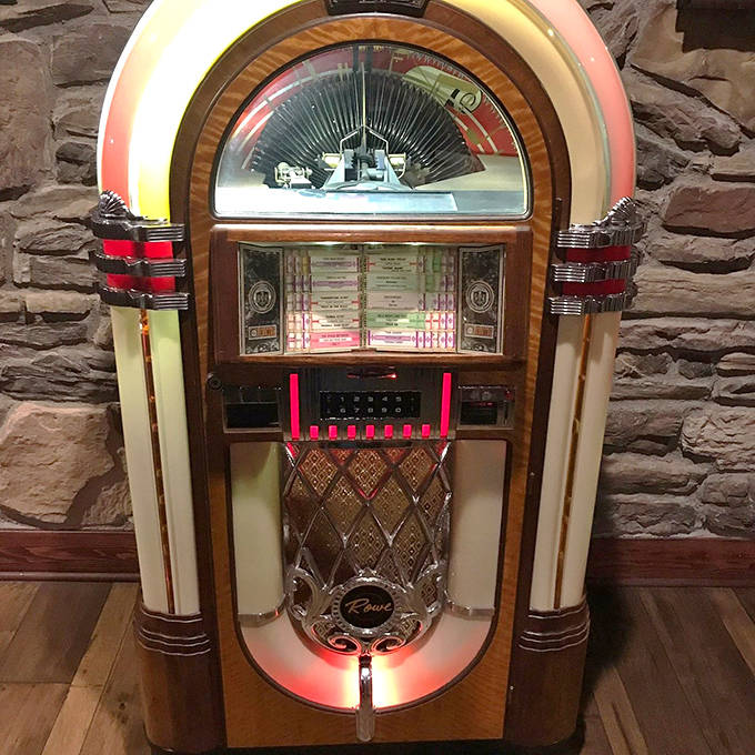 This vintage jukebox isn't just decoration &ndash; it's a time machine disguised as a music box, glowing with nostalgic charm.