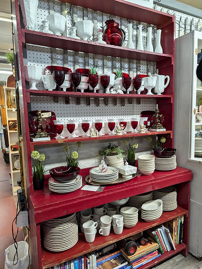 Ruby red glassware creates a dramatic display against white milk glass, showcasing the artistry of American glass manufacturing.
