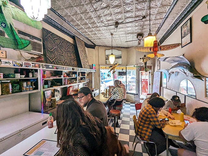 The dining area buzzes with conversation as customers from all walks of life unite in appreciation of unpretentious, delicious food.