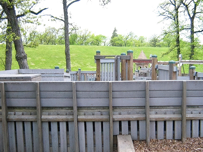 The playground's wooden construction connects children to natural materials in our increasingly plastic, digital world.